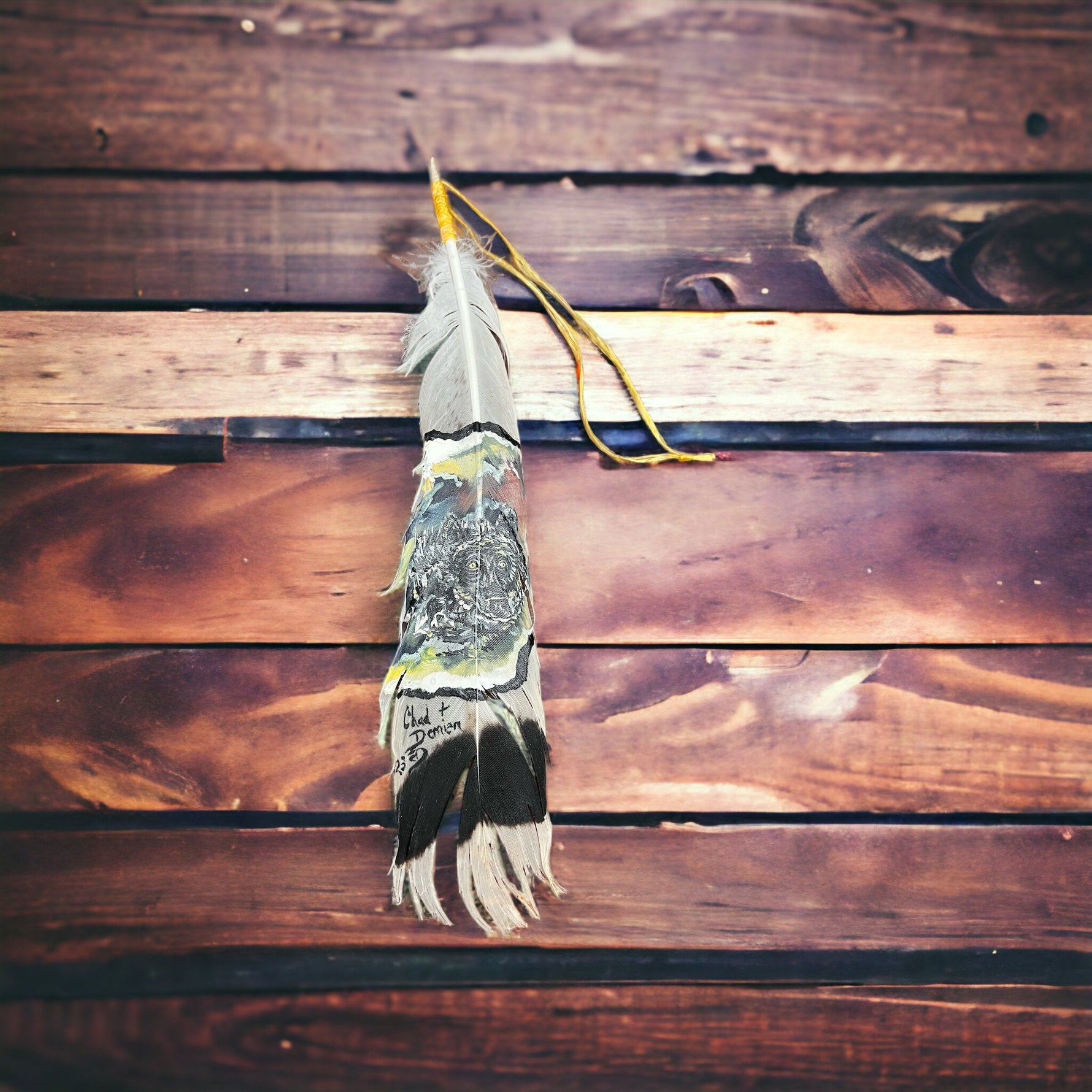 Painted hat feather by Chad Demien – Cowhide and Conchos